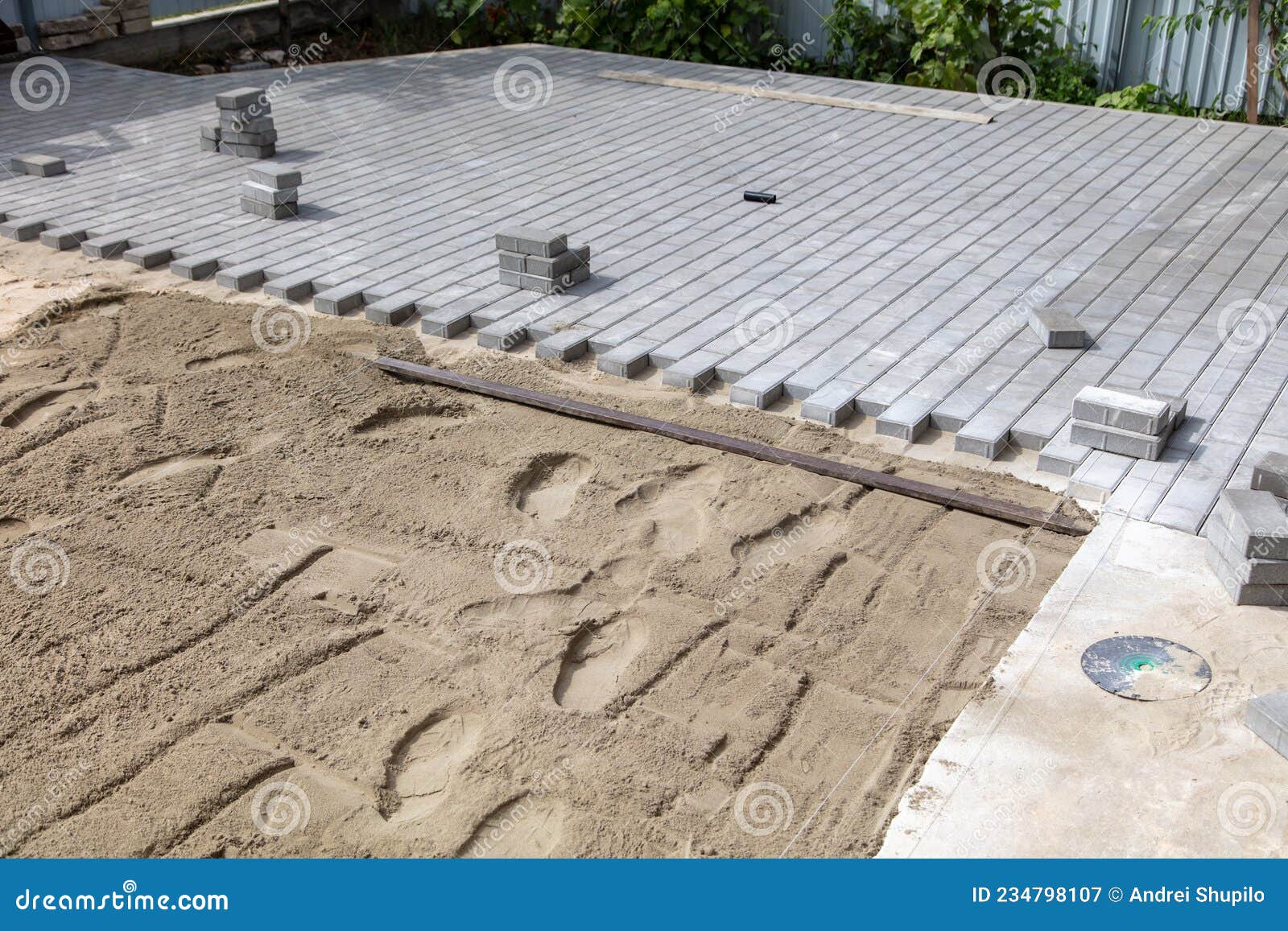 Laying Paving Slabs at a Construction Site. Stock Image - Image of grey ...
