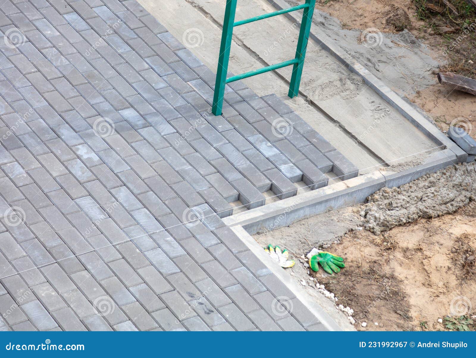 Laying Paving Slabs at a Construction Site. Stock Image - Image of sand ...