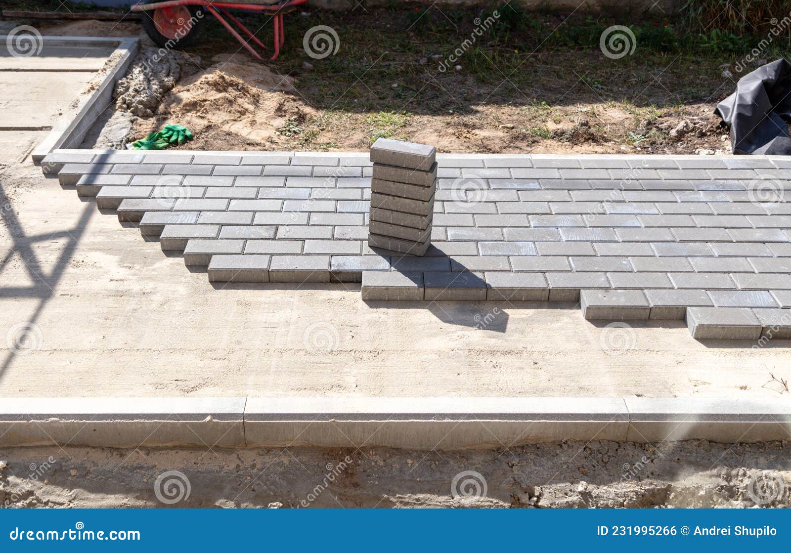 Laying Paving Slabs at a Construction Site. Stock Photo - Image of grey ...