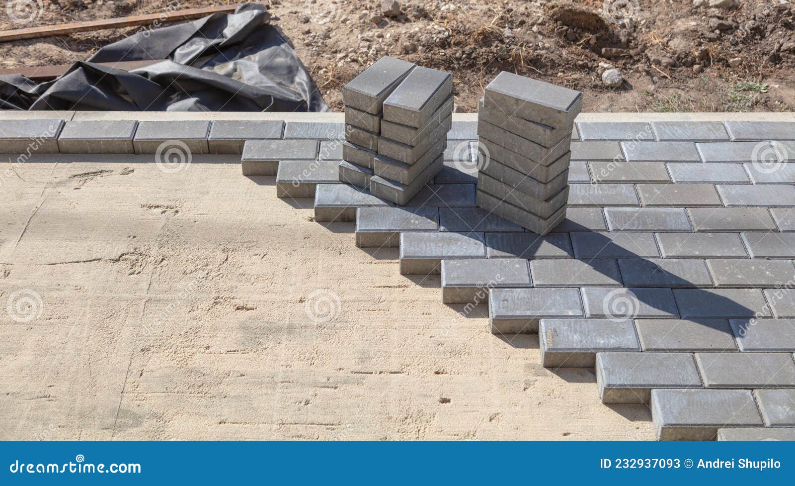 Laying Paving Slabs at a Construction Site. Stock Image - Image of ...