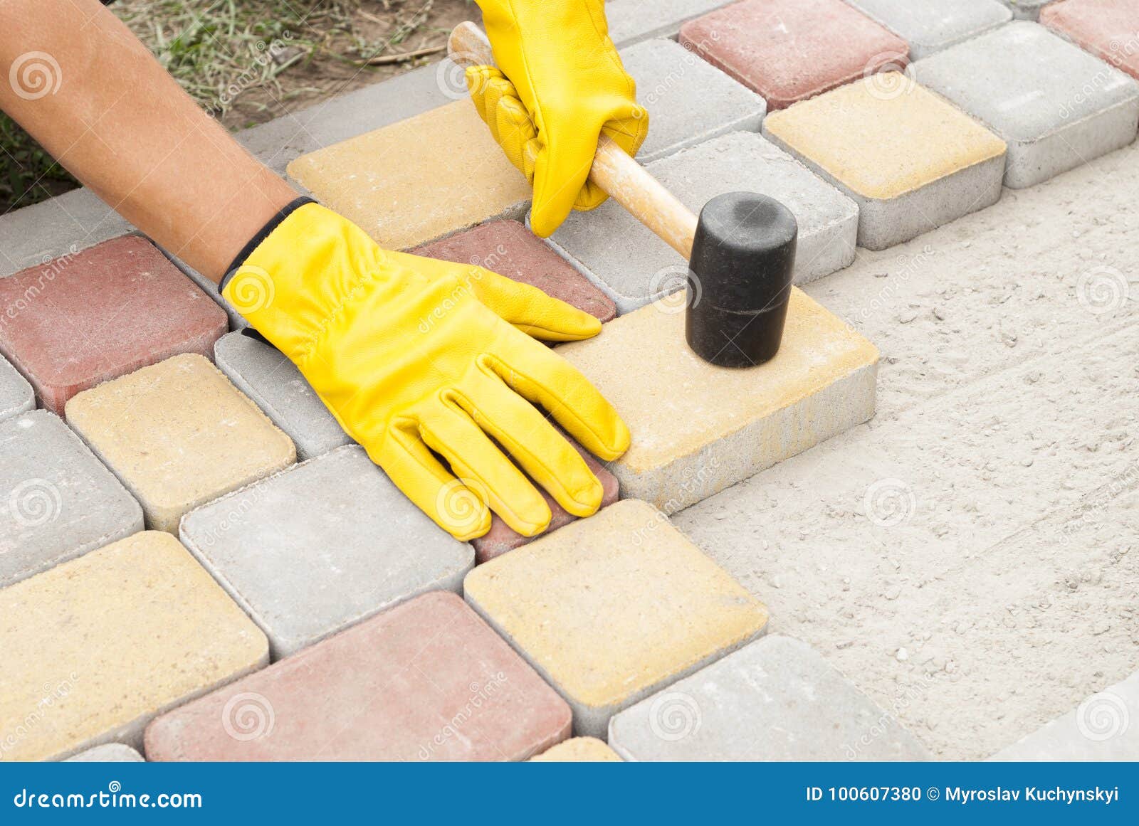 Laying of paving slabs stock photo. Image of mosaic - 100607380