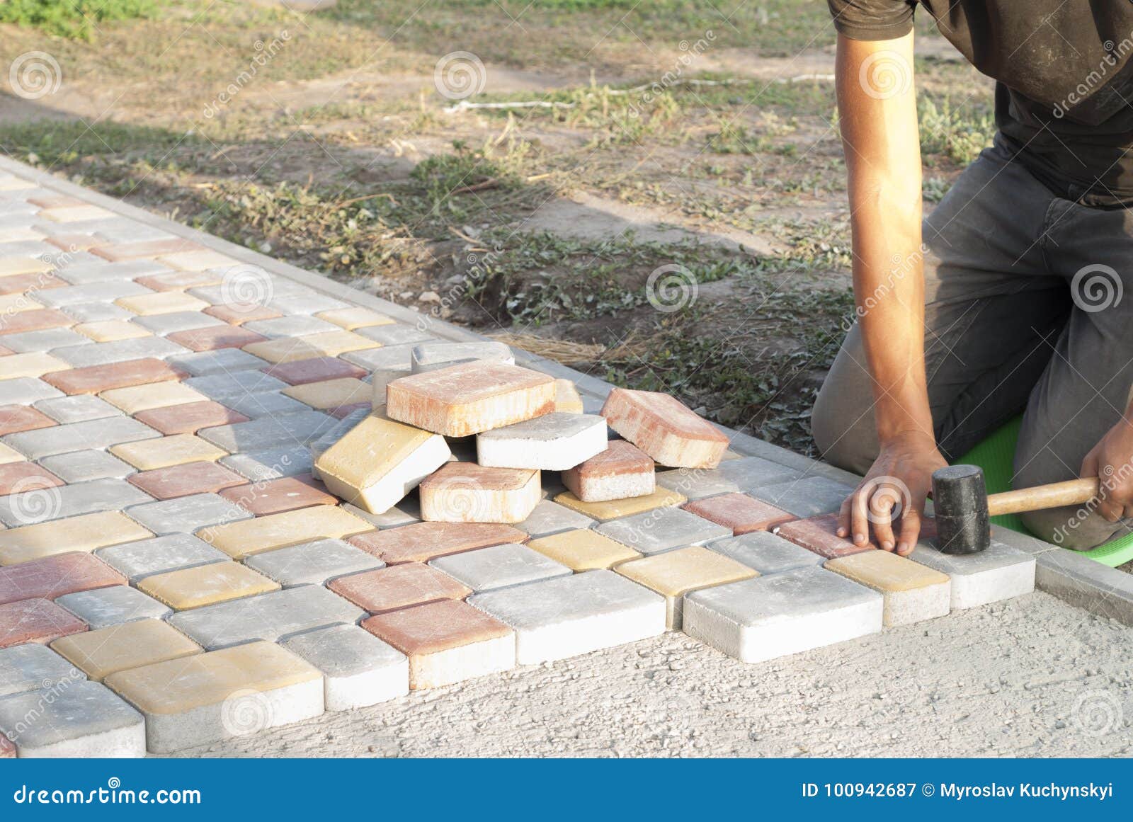 Laying of paving slabs stock image. Image of manual - 100942687