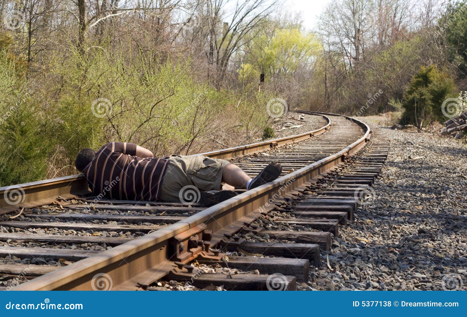 Laying on the Rails stock photo. Image of body, outdoors - 5377138
