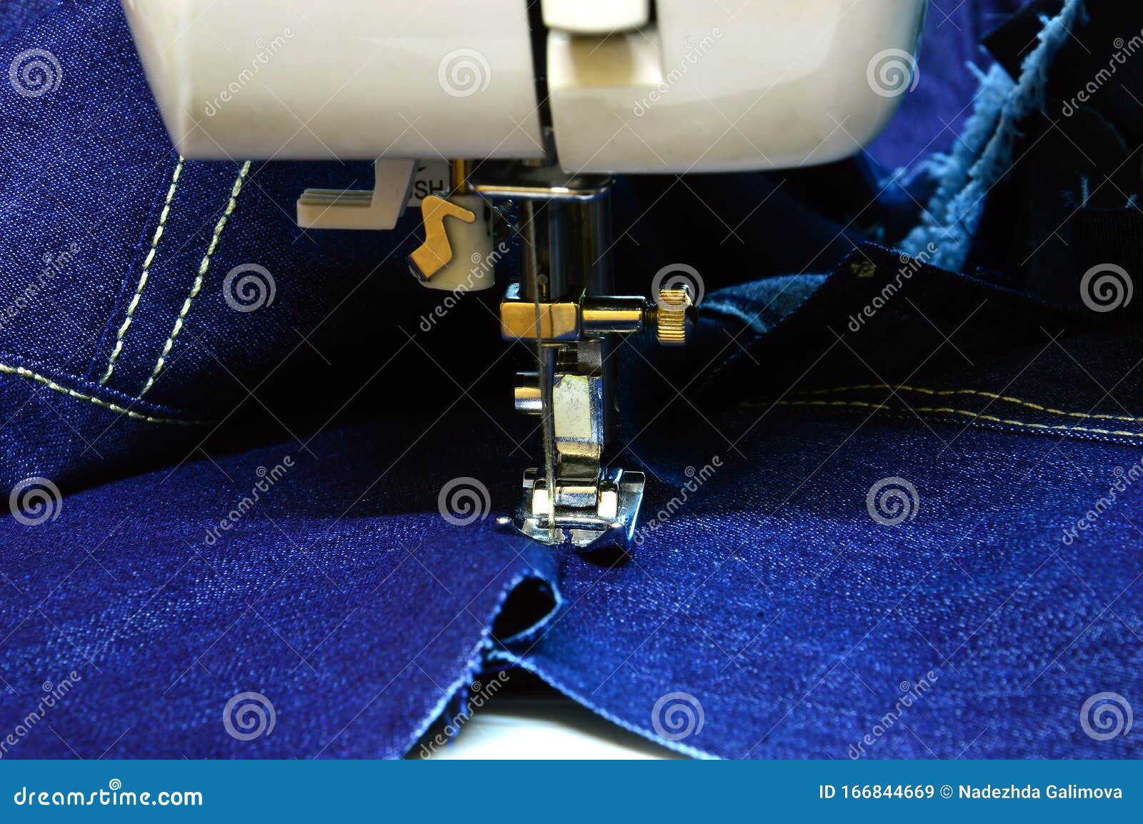 Laying a Smooth Stitch on Denim on a Sewing Machine. Technology of ...