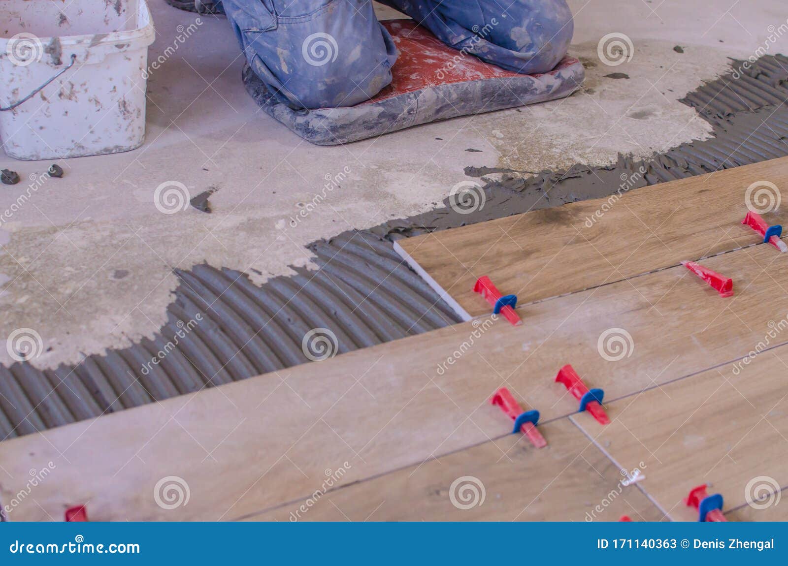 Laying Tile on the Floor, Ceramic Tile Laying, Pressing Down and ...