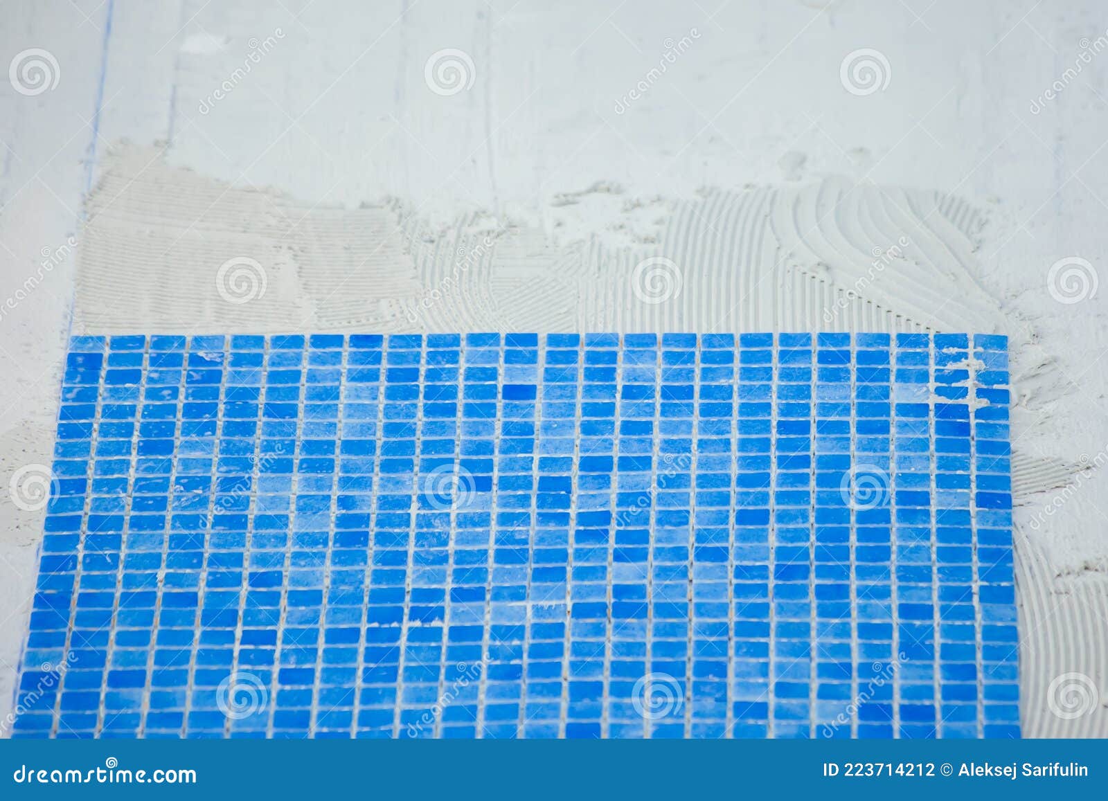 Laying Tile in the Pool. Pool Repairing Work Stock Photo - Image of ...