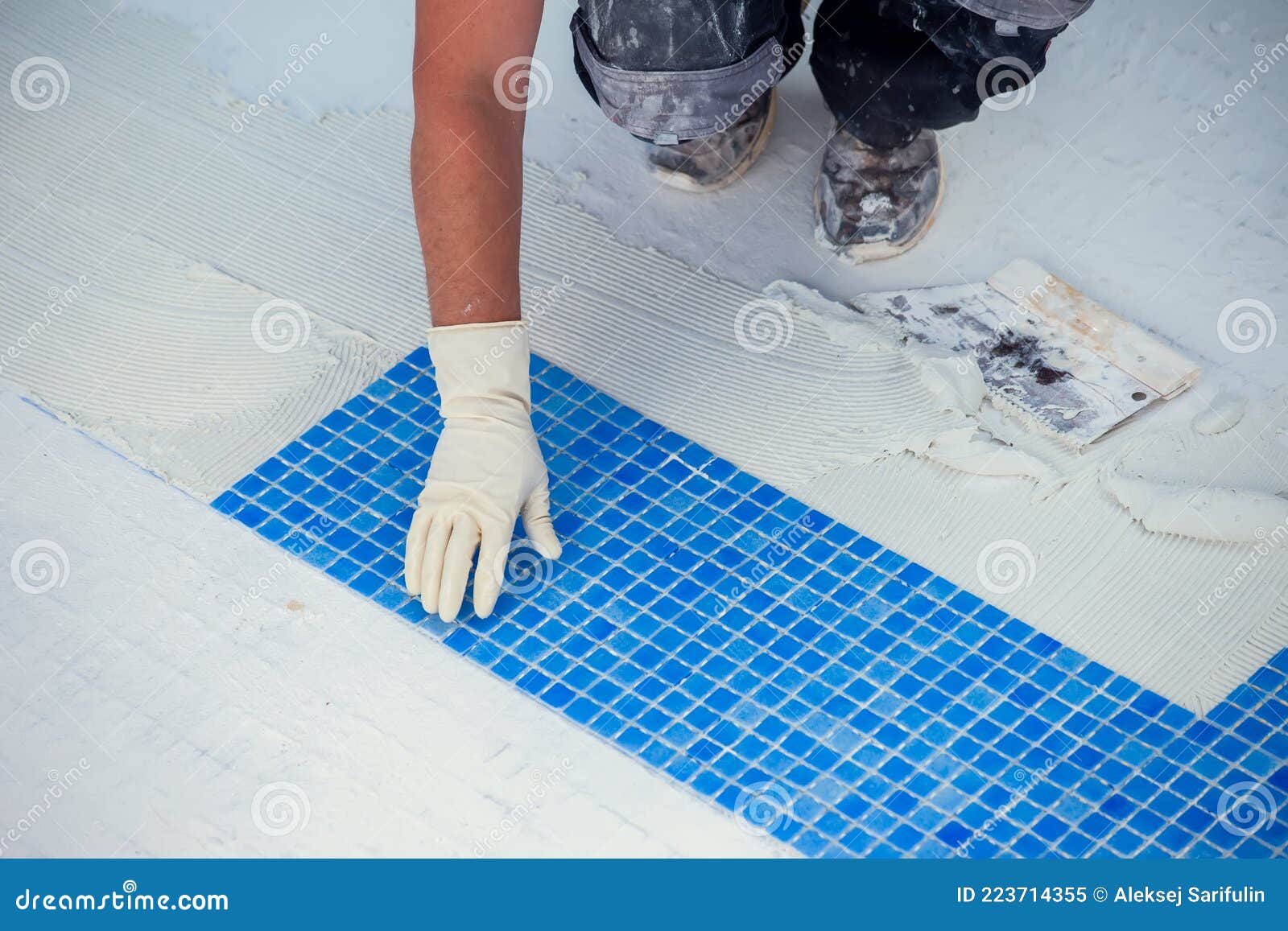Laying Tile in the Pool. Pool Repairing Work Stock Image - Image of ...