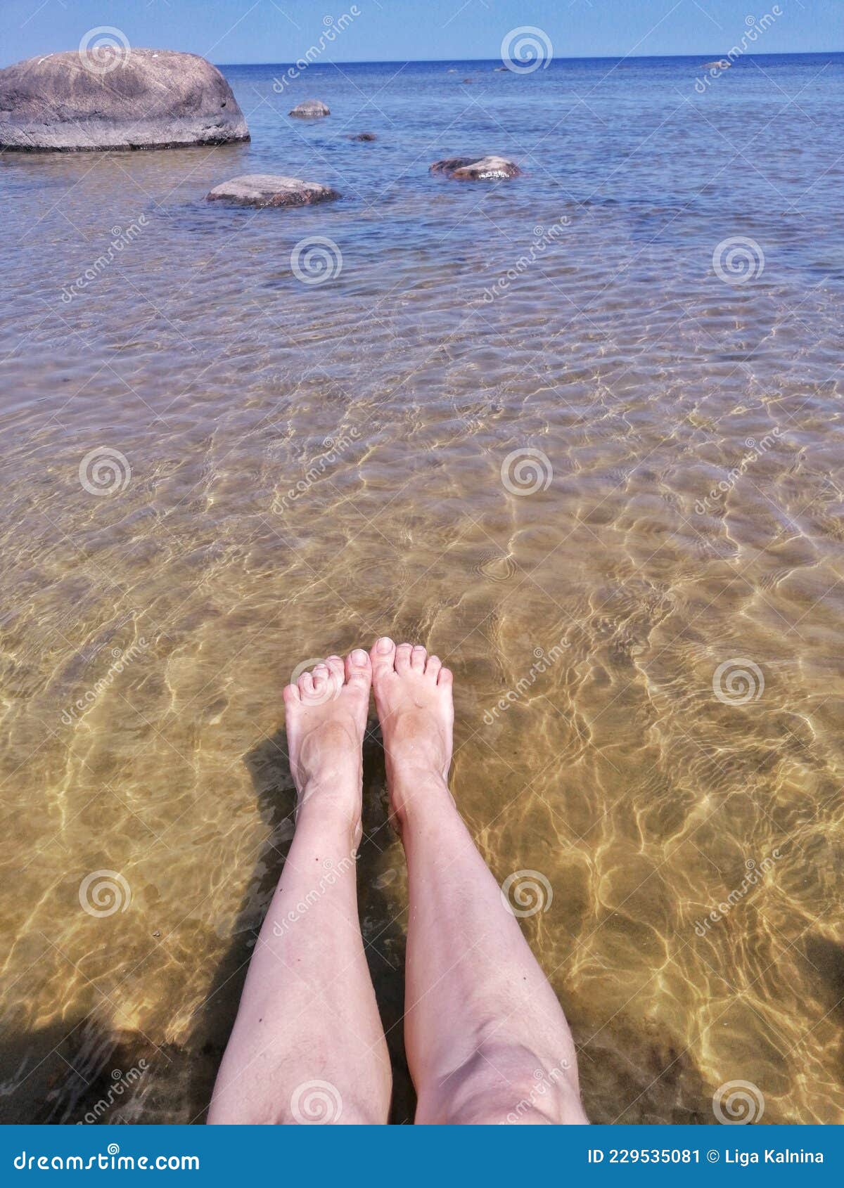 Laying in water stock image. Image of ocean, horizon - 229535081