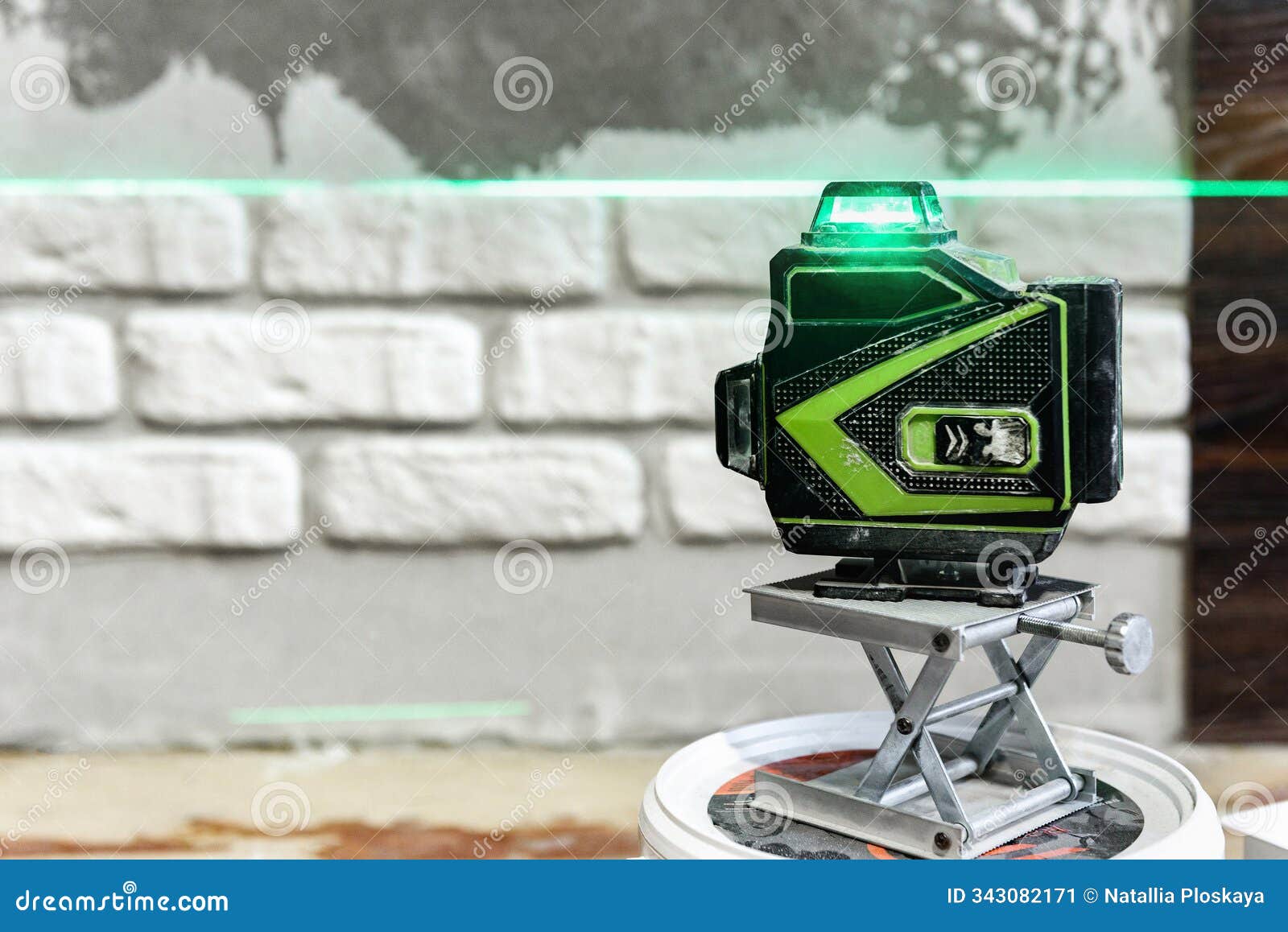 Laying of White Gypsum Tiles Using a Laser Level. Stock Image - Image ...