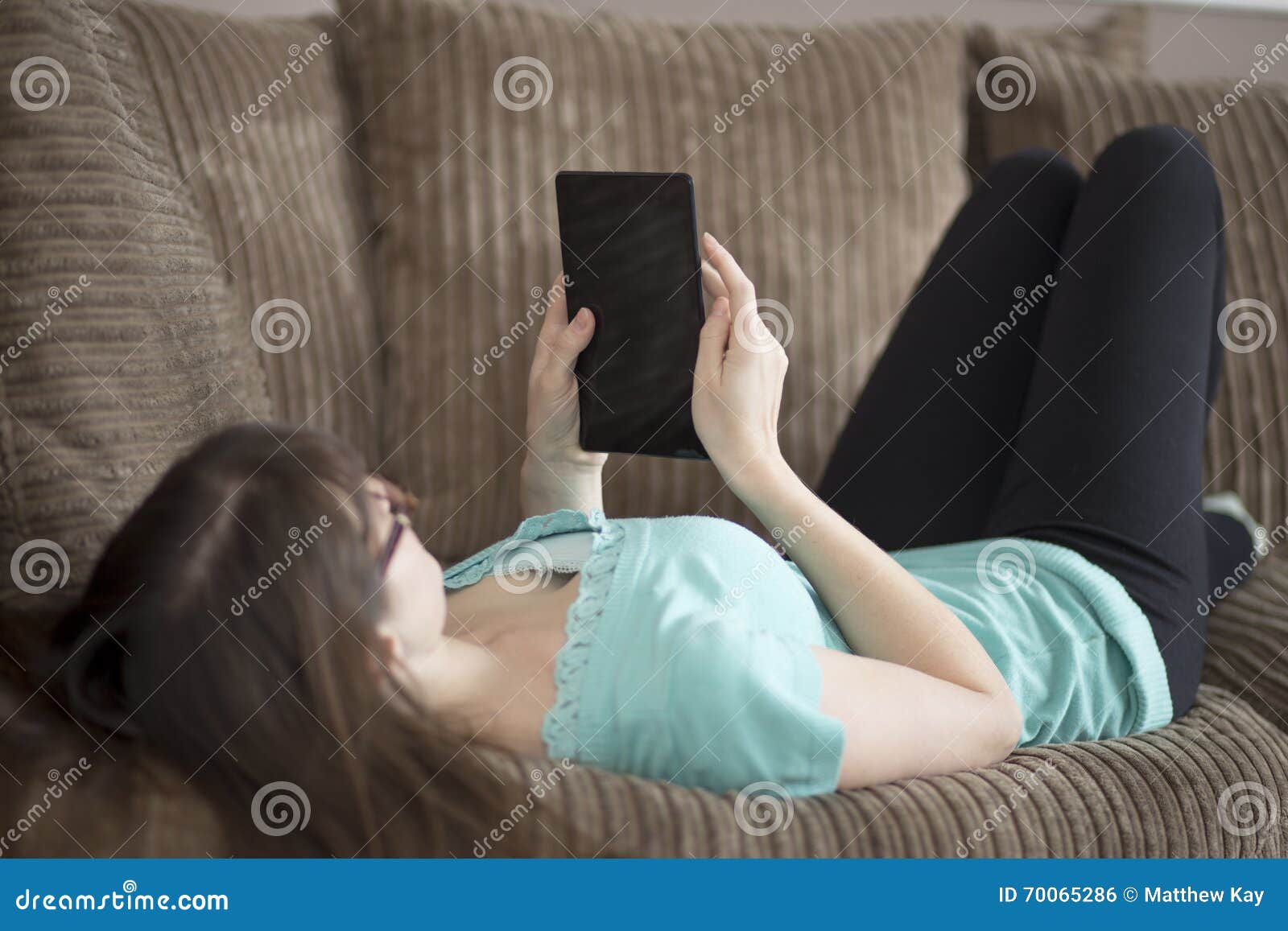 Lazing on the Sofa with Tablet PC Stock Photo - Image of interior ...