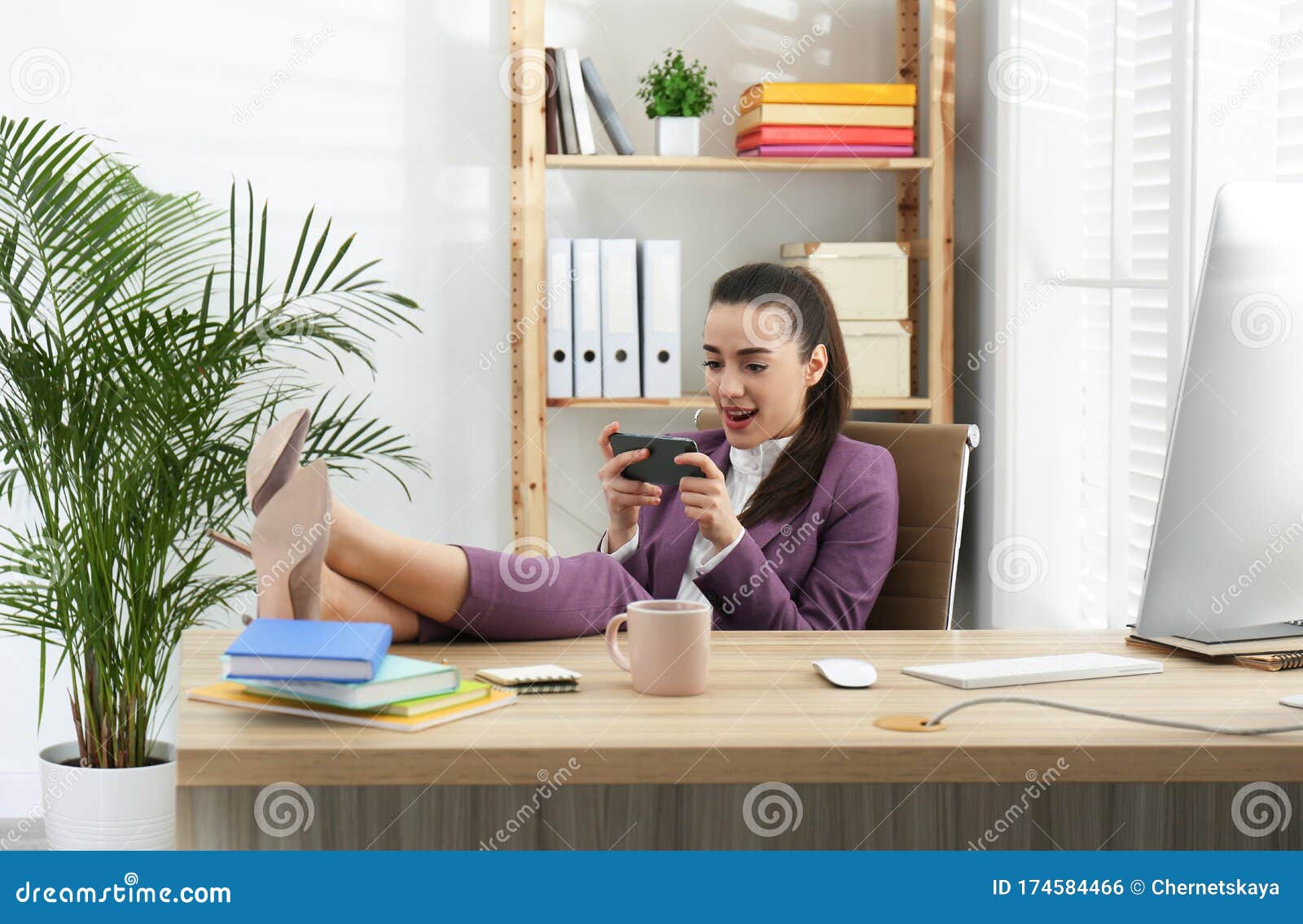 Lazy Employee Using Smartphone at Table in Office Stock Photo - Image ...