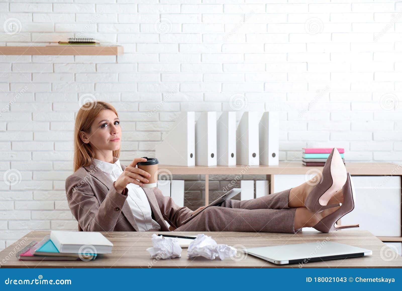Lazy Employee Using Tablet while Resting at Table Stock Image - Image ...