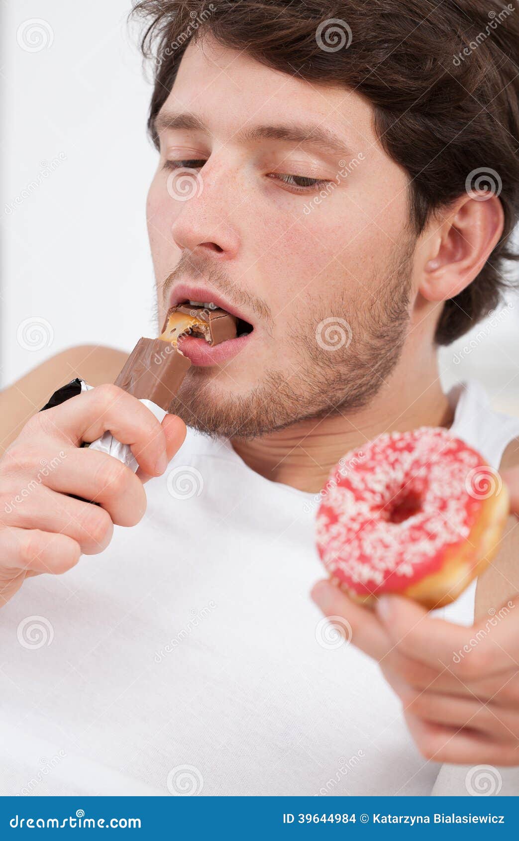 Lazy man eating sweets stock photo. Image of comfortable - 39644984