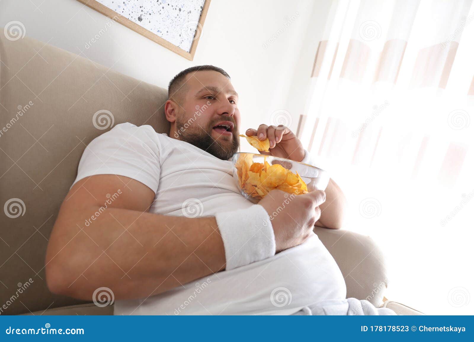 Lazy Overweight Man Eating Chips Stock Image - Image of overweight ... Lazy Overweight Man Eating Chips Stock Image - Image of overweight ...
