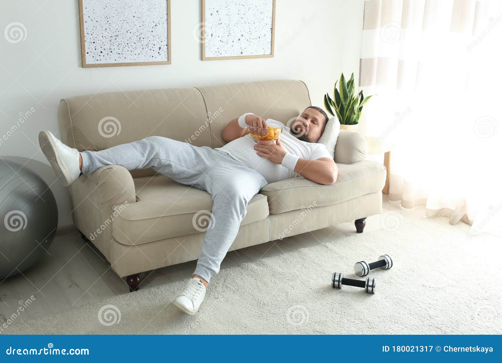 Lazy Overweight Man Eating Chips on Sofa Stock Image - Image of home ... Lazy Overweight Man Eating Chips on Sofa Stock Image - Image of home ...