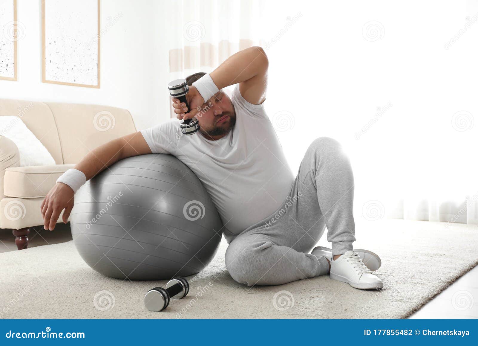 Lazy Overweight Man with Sport Equipment on Floor Stock Photo - Image ... Lazy Overweight Man with Sport Equipment on Floor Stock Photo - Image ...
