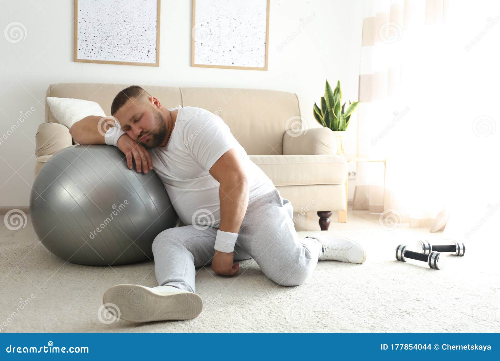 Lazy Overweight Man with Sport Equipment Sleeping on Floor Stock Photo ... Lazy Overweight Man with Sport Equipment Sleeping on Floor Stock Photo ...