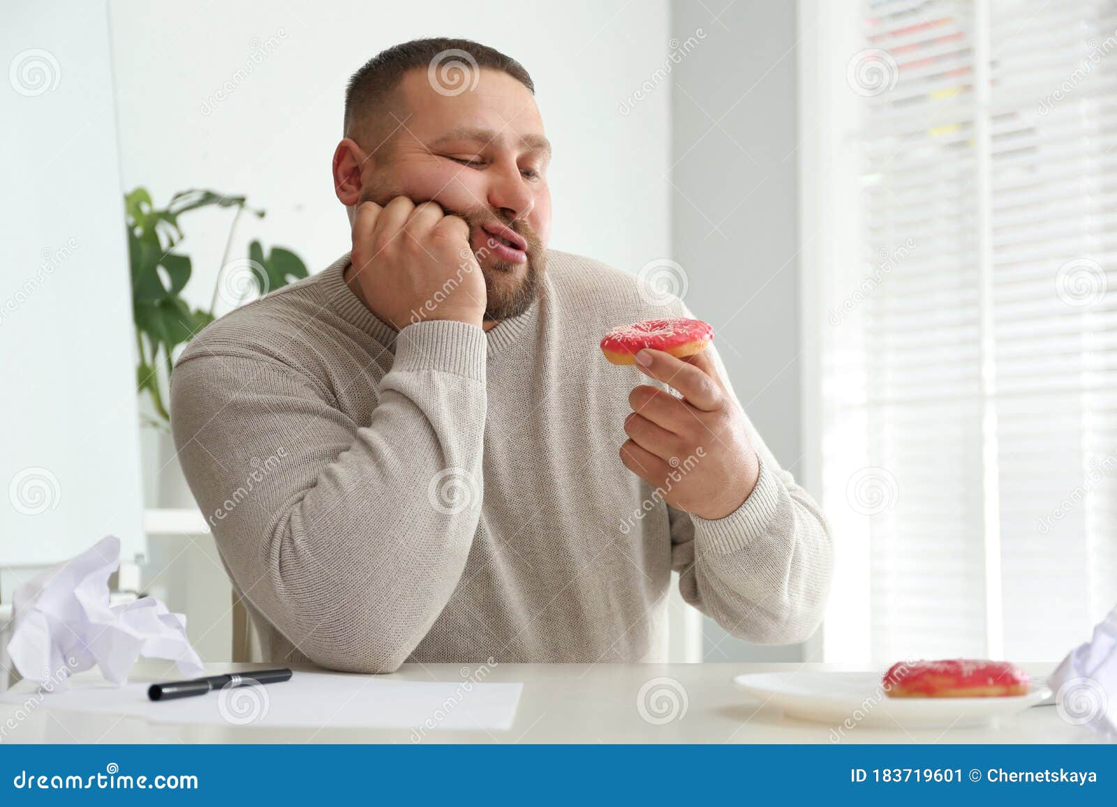 Overweight Office Employee with Donut at Workplace Stock Image - Image ...