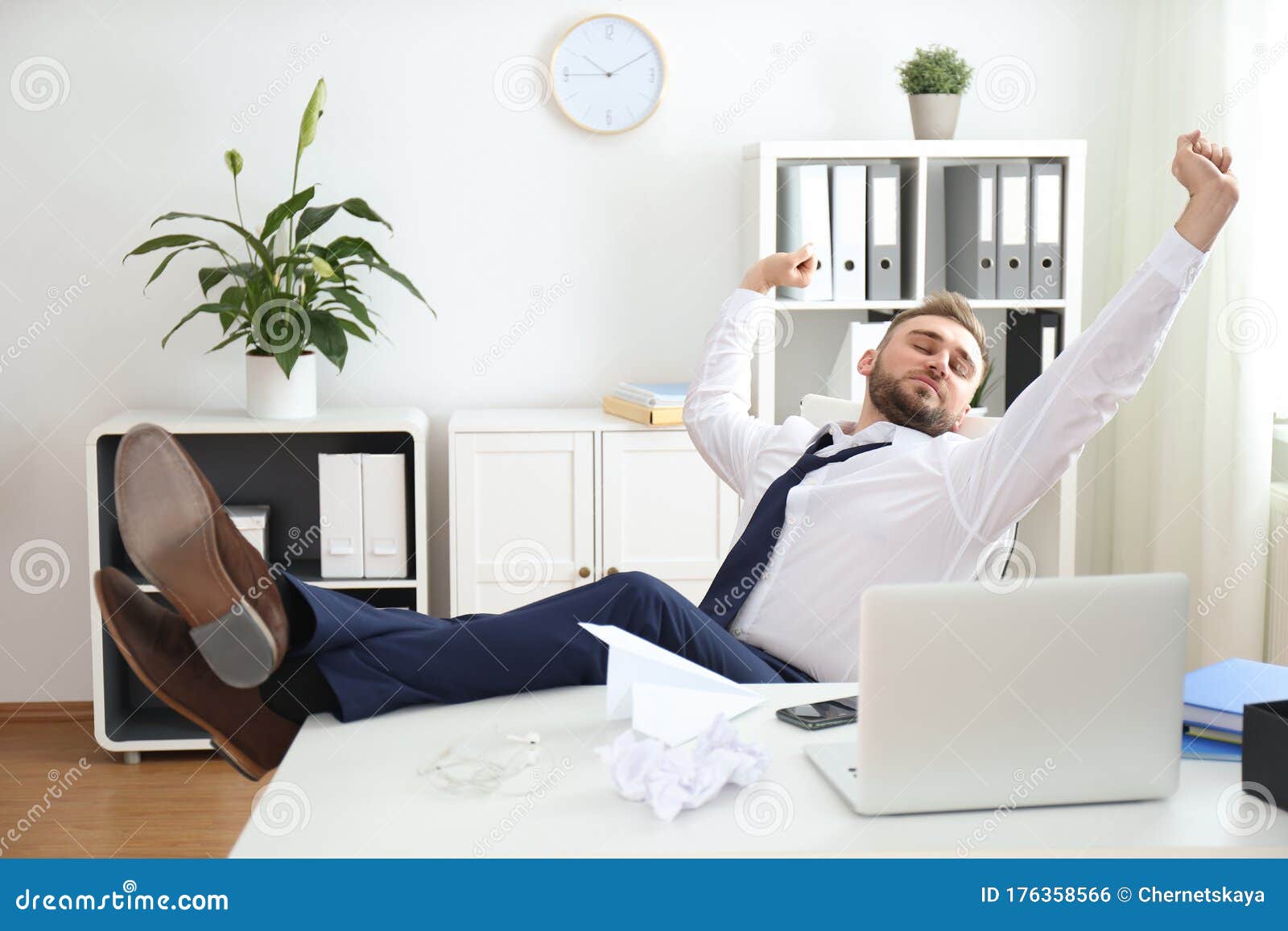 Lazy Young Man Stretching in Office Stock Photo - Image of office, lazy ...