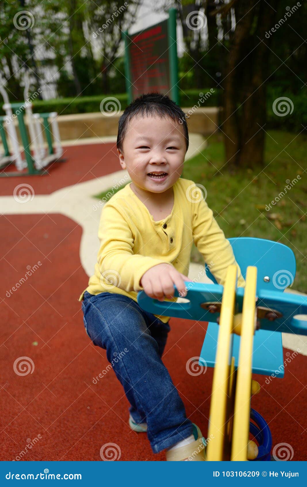 Lboy Riding an Yellow Horse at the Playground Stock Image - Image of ...