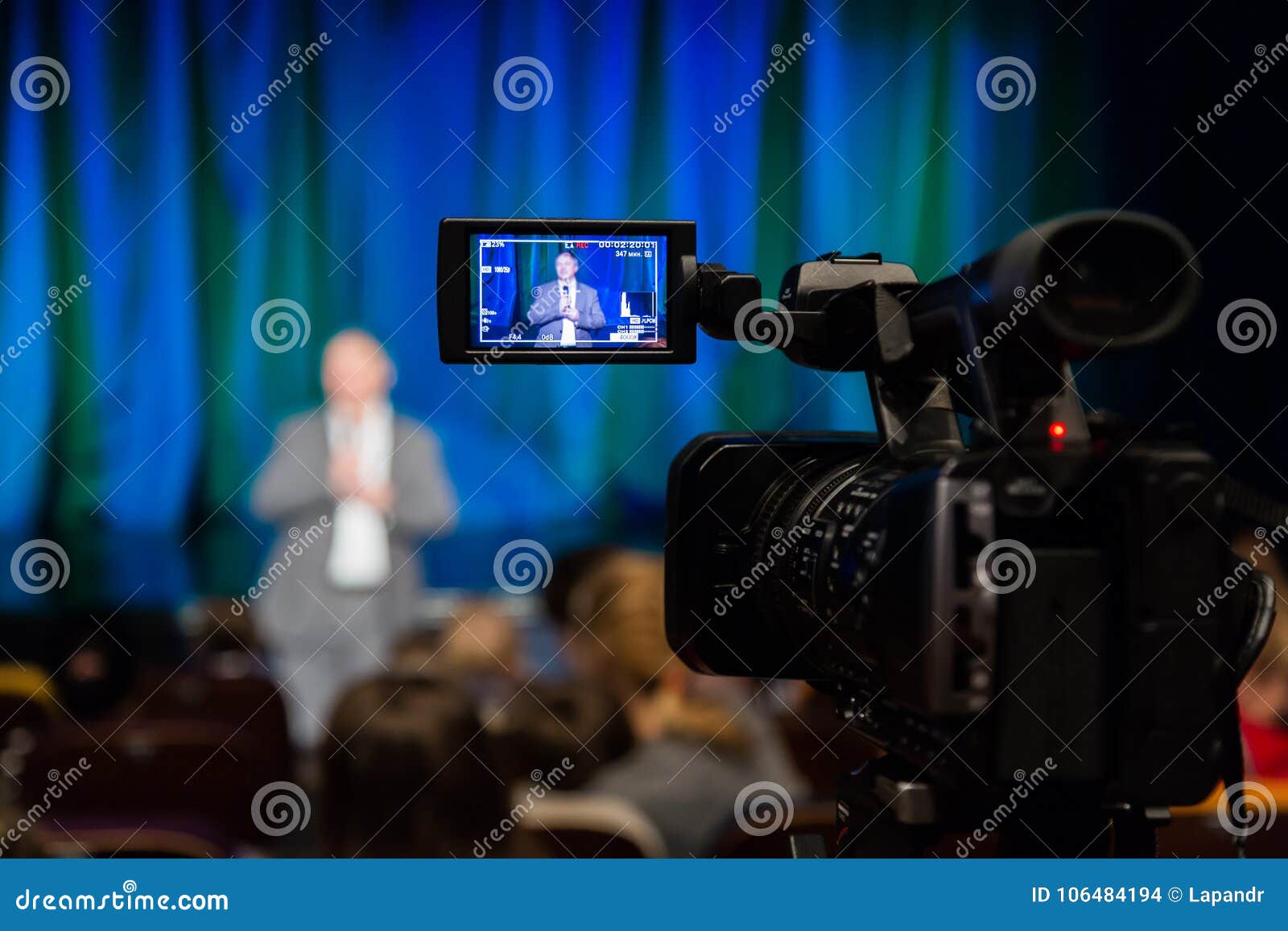 The LCD Display on the Camcorder. Shooting Event. a Man Stands in Front ...