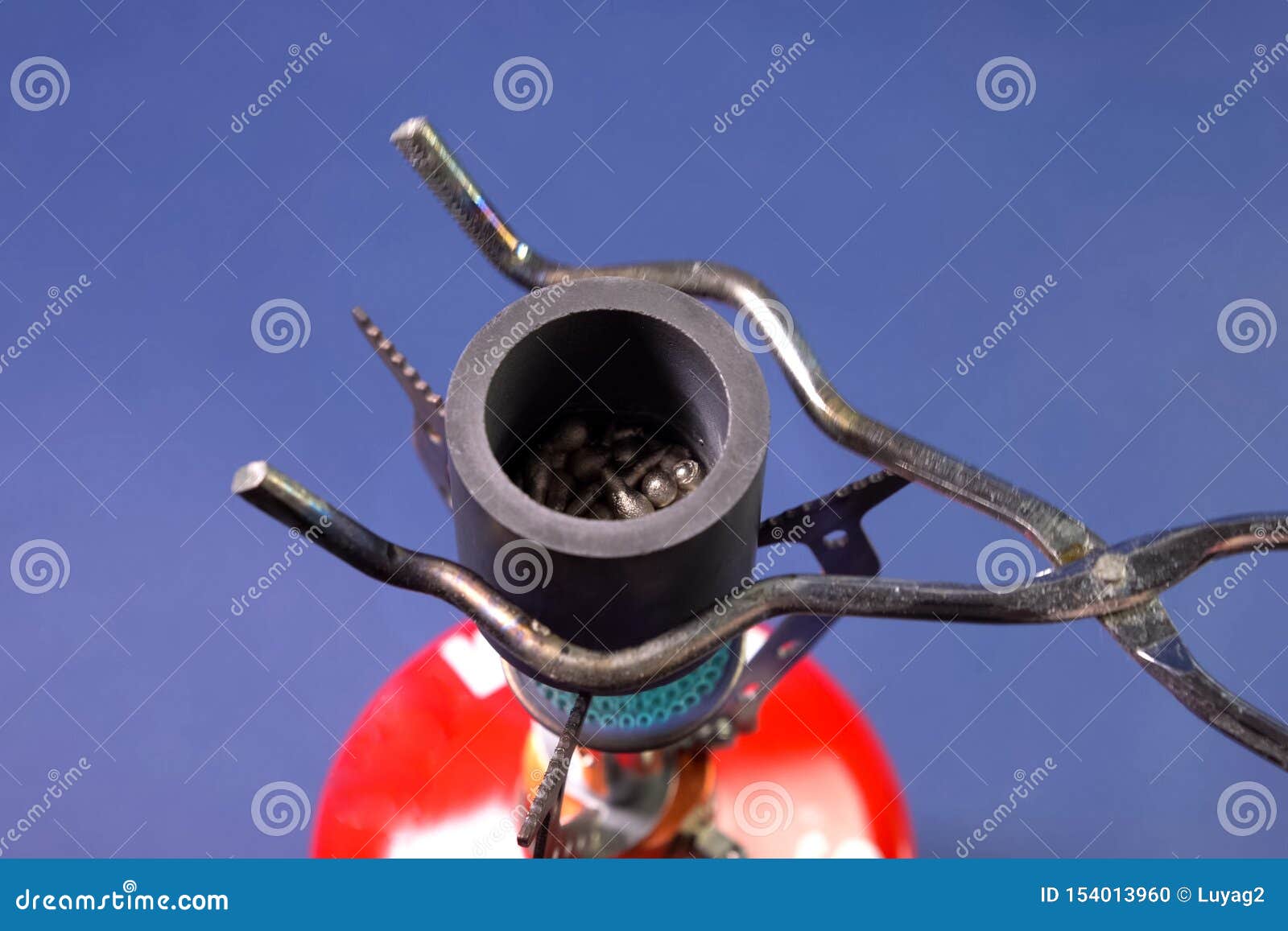 Lead melting, molten lead stock photo. Image of holding - 154013960