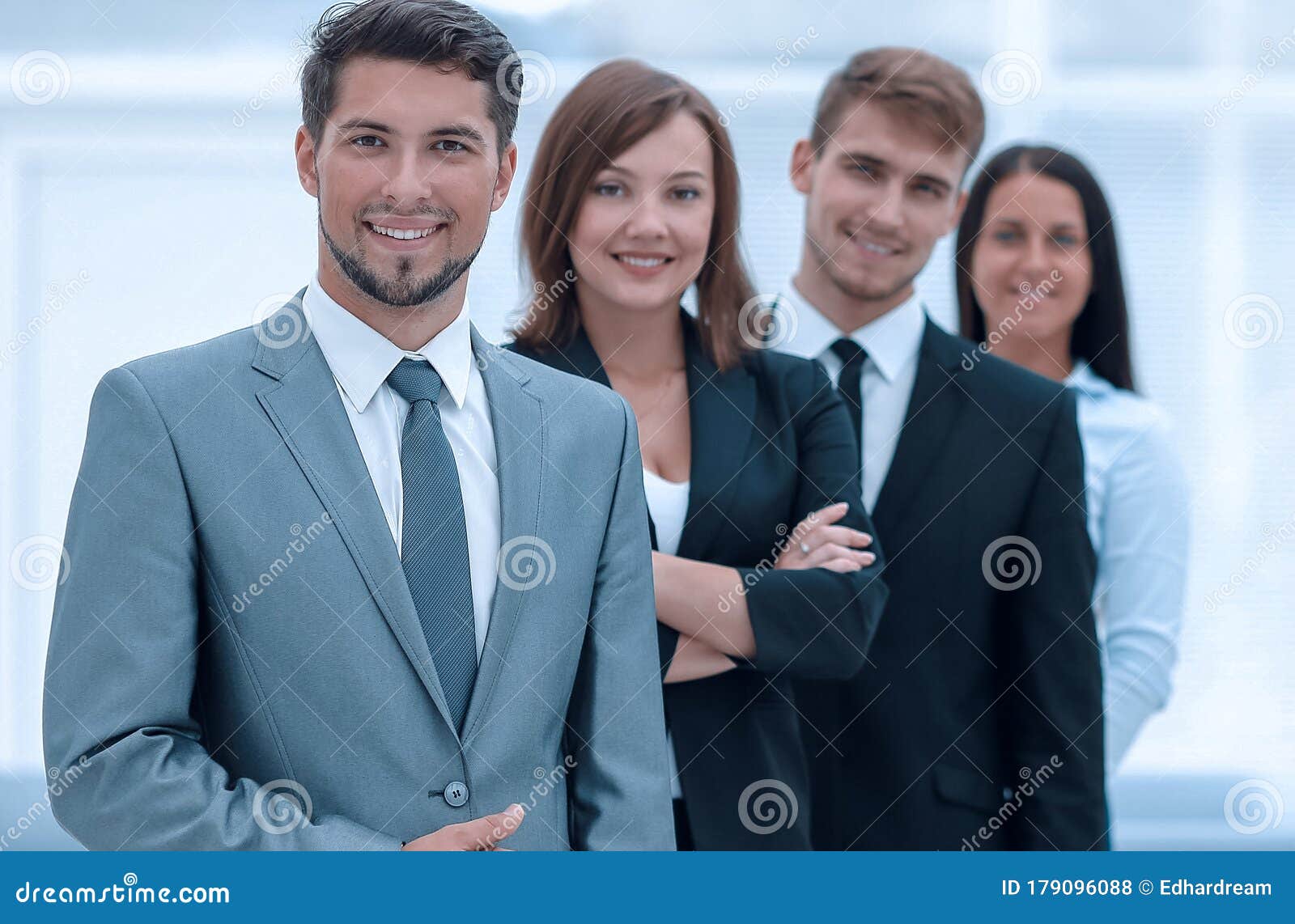 Leader and the Business Team Standing One Behind the Other. Stock Photo ...