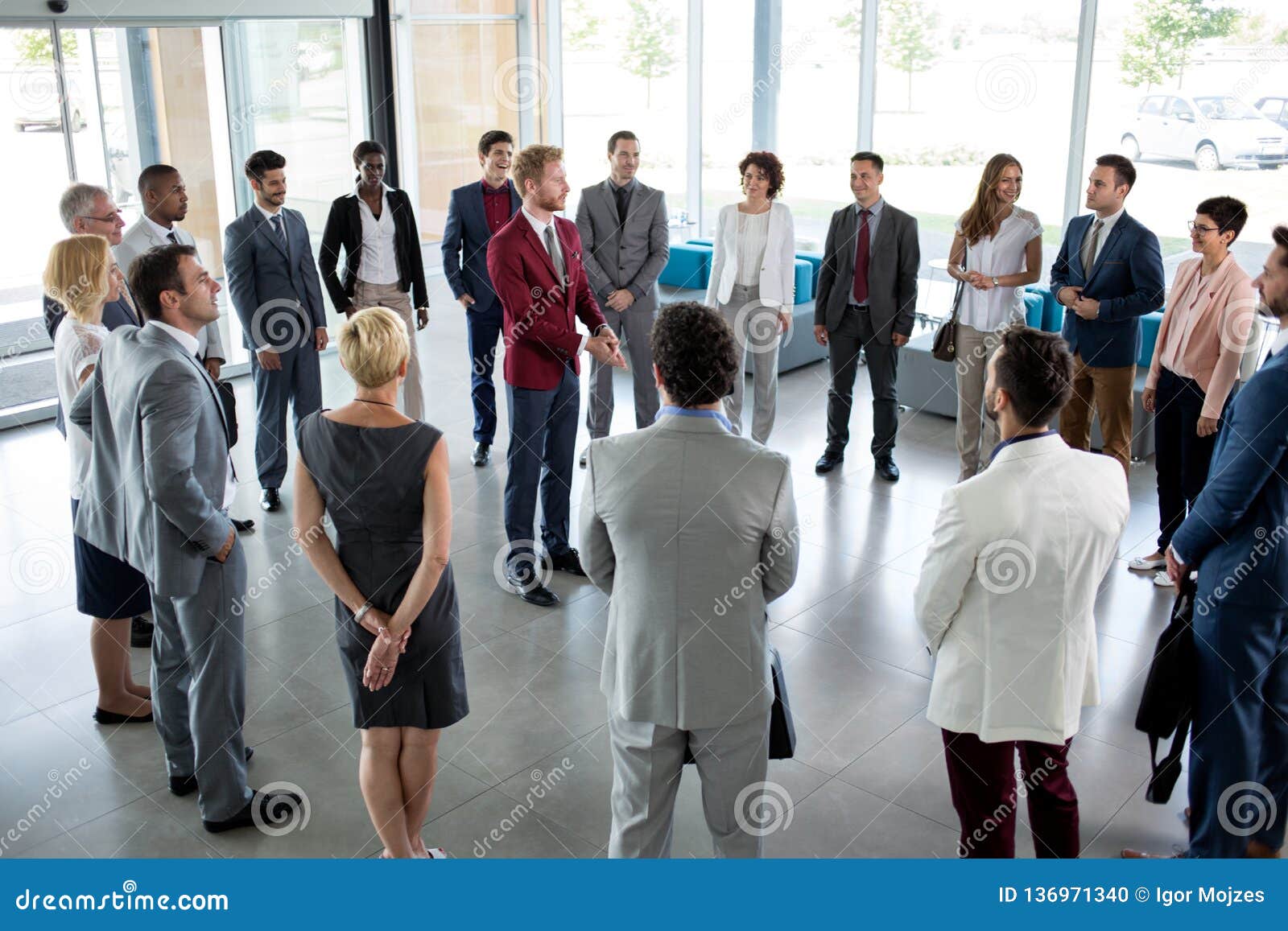 Leader Standing in Circle of His Successful Business Team Stock Photo ...