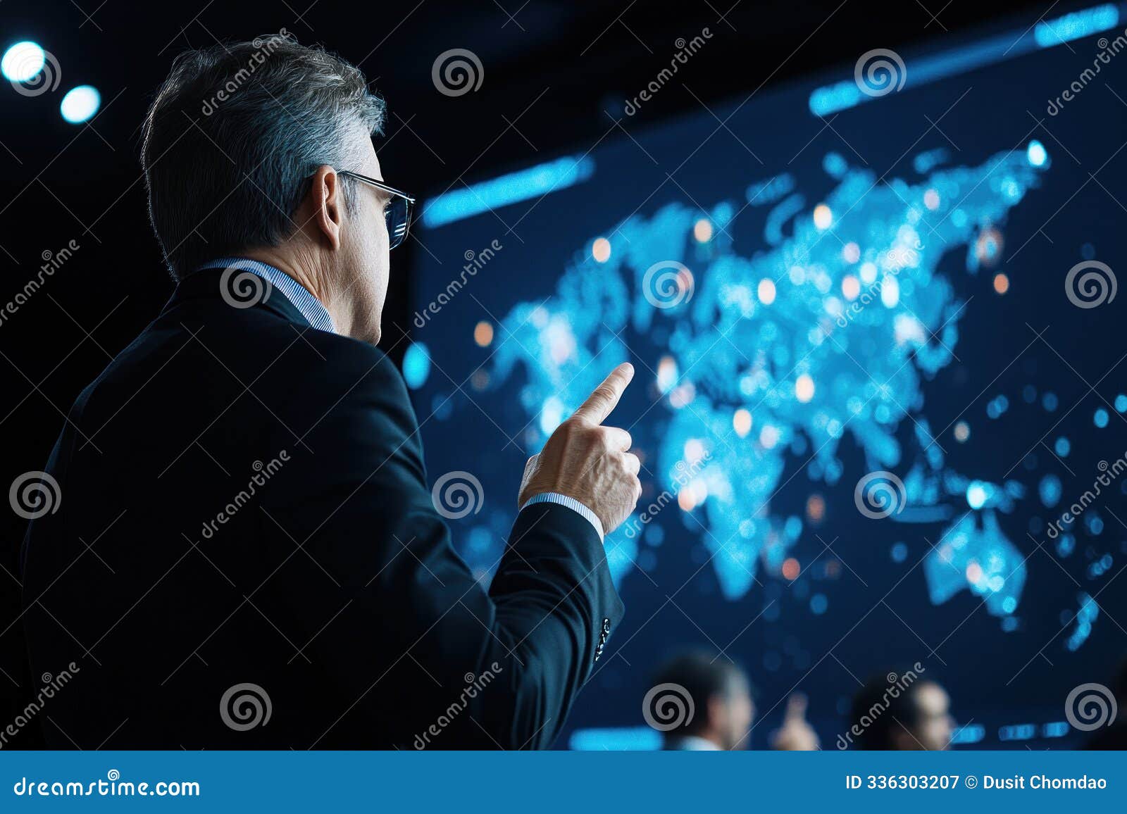 A Leader Standing in Front of Large Screen Displaying World Map ...