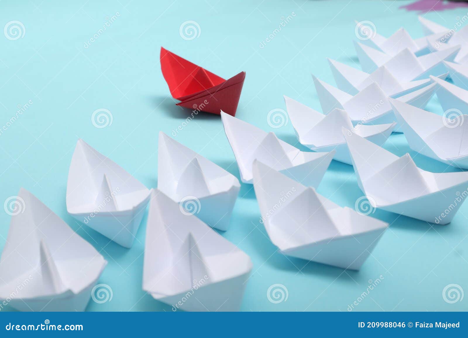 Leadership Concept with Red Paper Ship Leading among Group of White ...