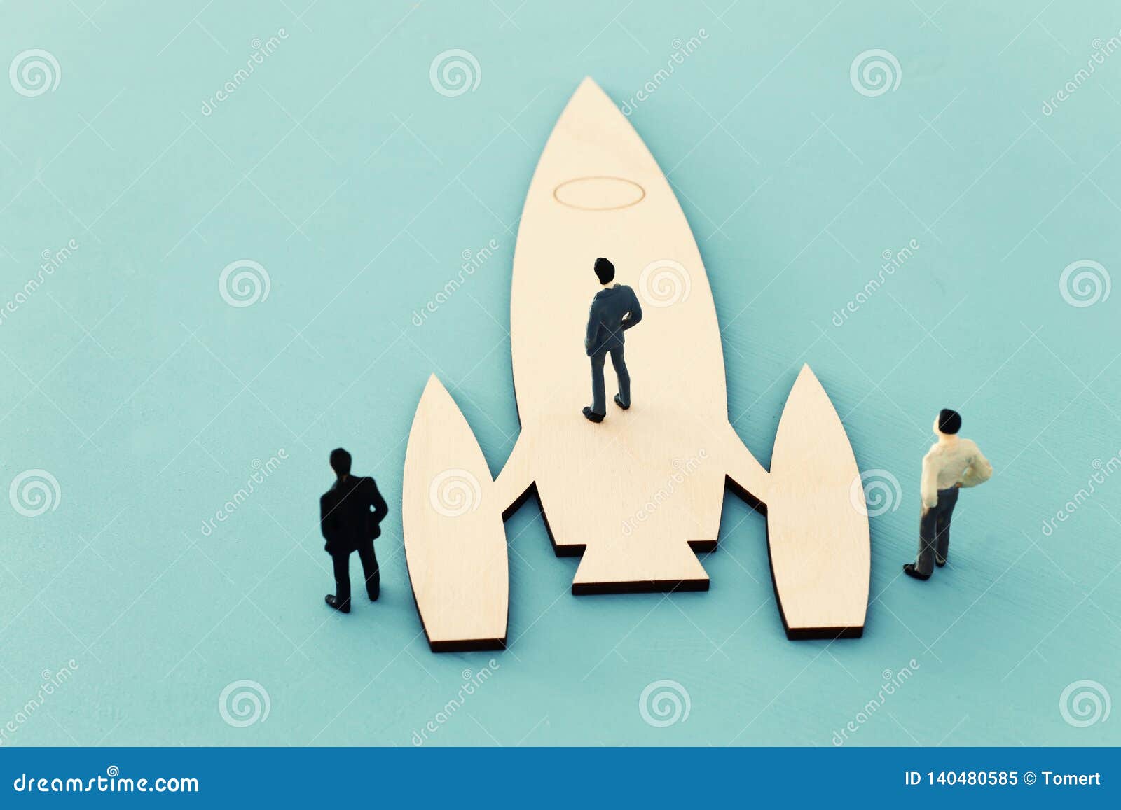 Leadership and Teamwork Concept Miniature People and Rocket ...