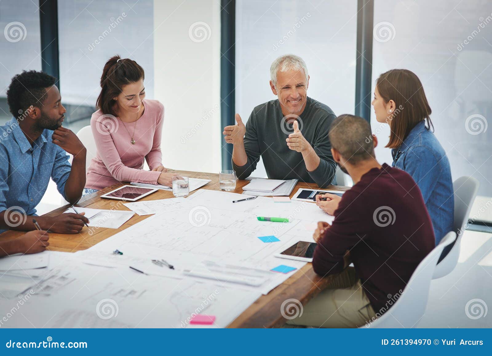 Leading the Creative Discussion. a Group of Architects Looking Over ...