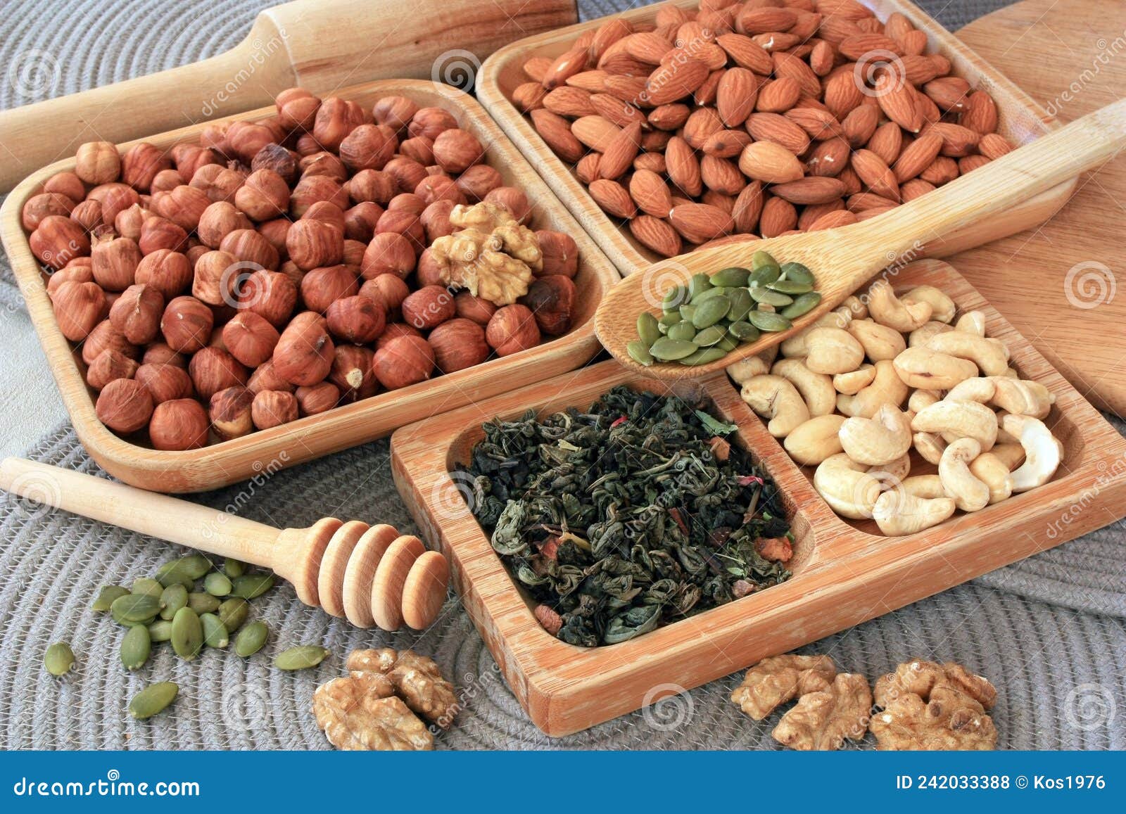 Leafy green tea and nuts stock photo. Image of nutrition - 242033388