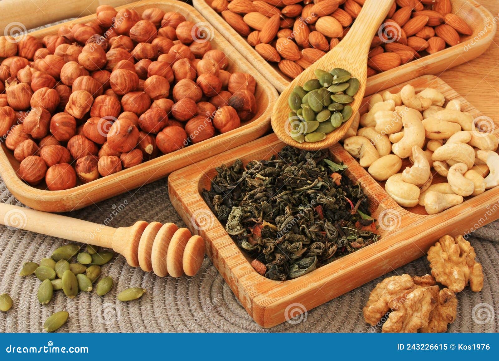 Leafy green tea and nuts stock image. Image of pecan - 243226615