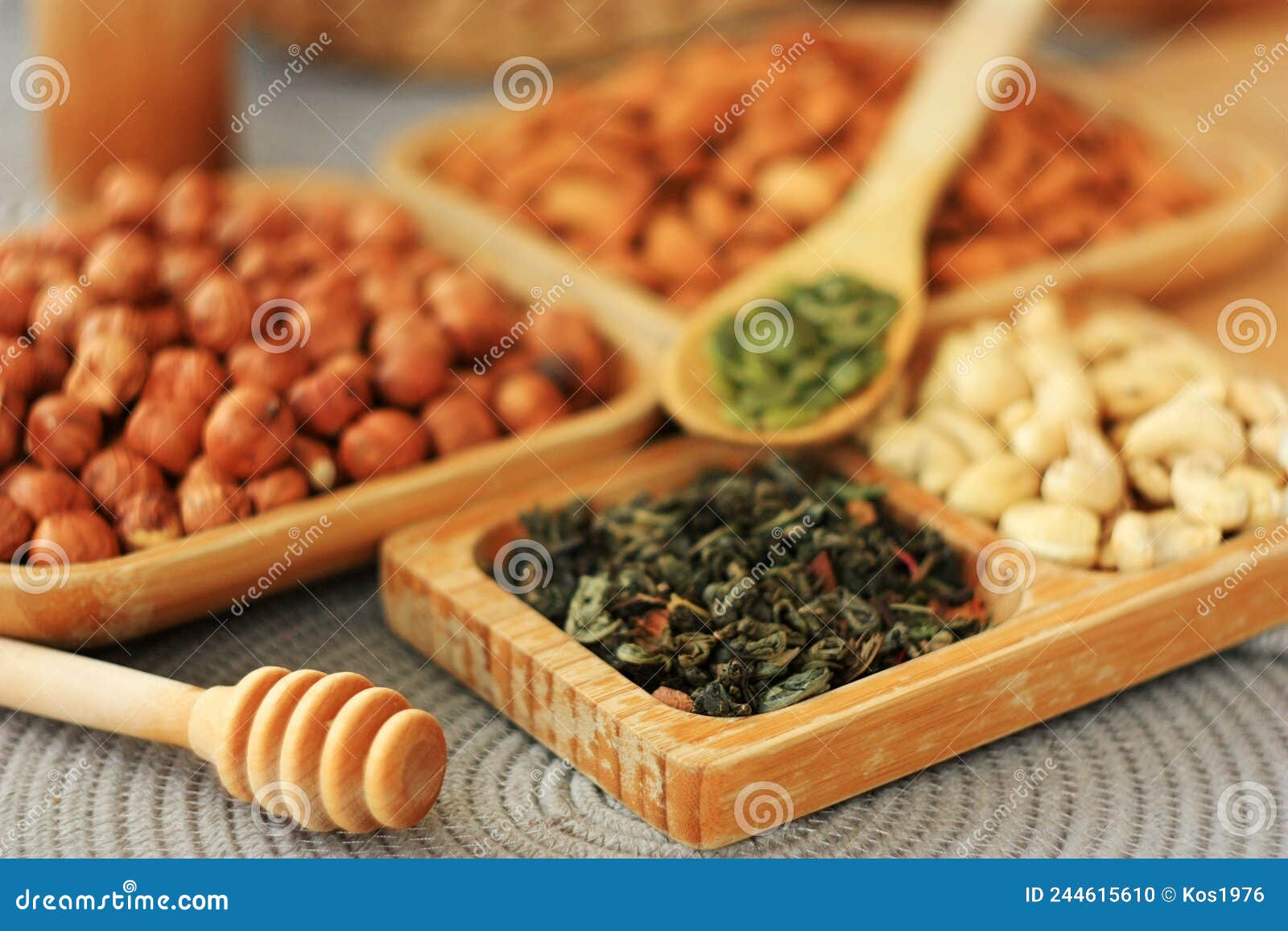 Leafy green tea and nuts stock photo. Image of hazelnut - 244615610