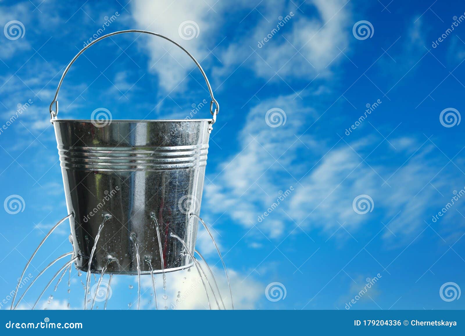 Leaky Bucket With Water On Background Royalty-Free Stock Photo ...