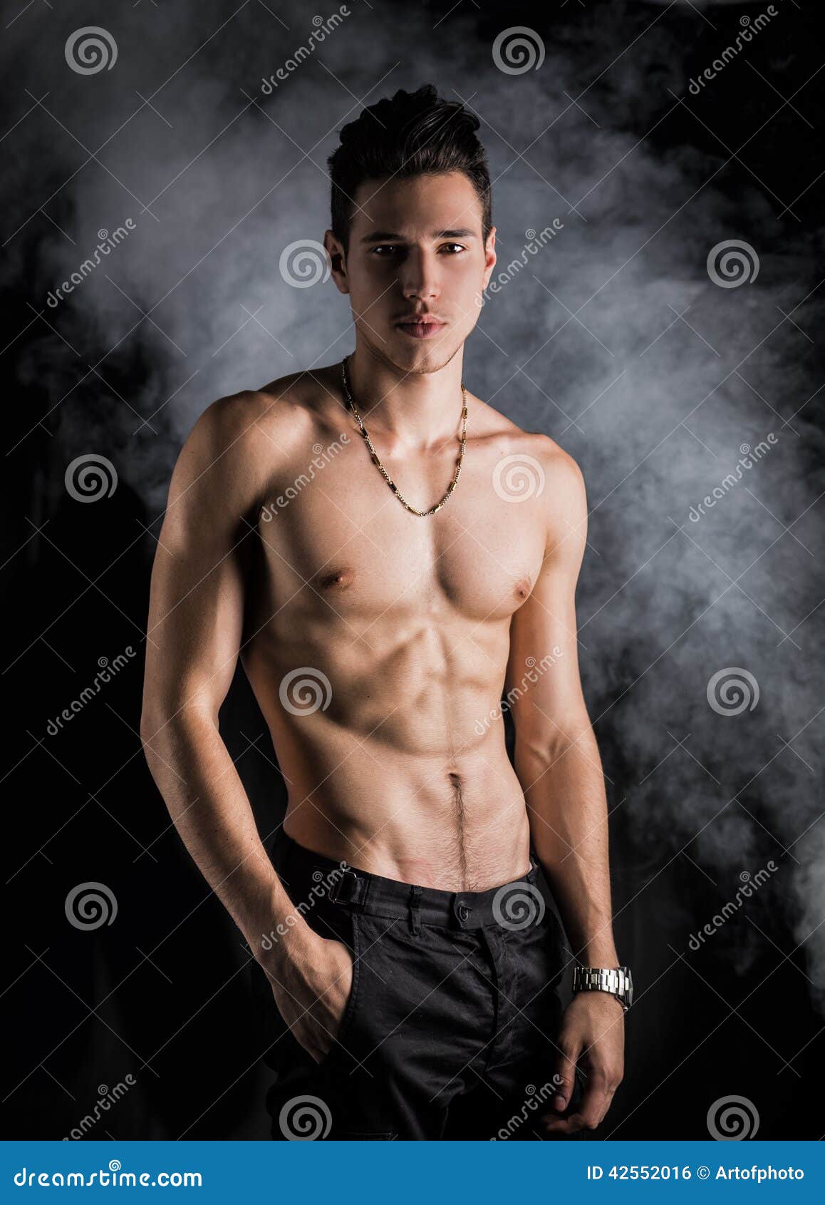 Lean Athletic Shirtless Young Man Standing On Dark Background Royalty ...