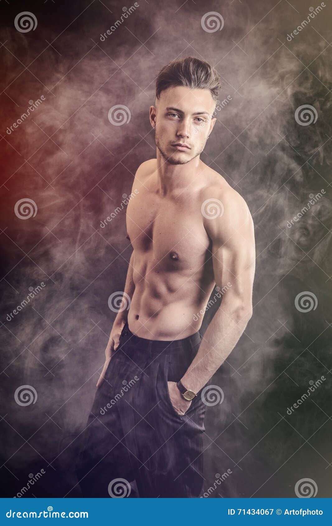 Lean Athletic Shirtless Young Man Standing On Dark Background Royalty ...