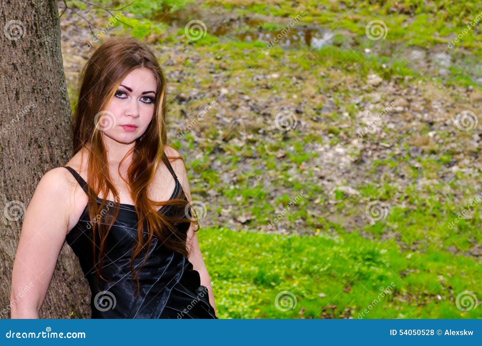 She is Leaning Back Against the Tree Stock Photo - Image of alone ...