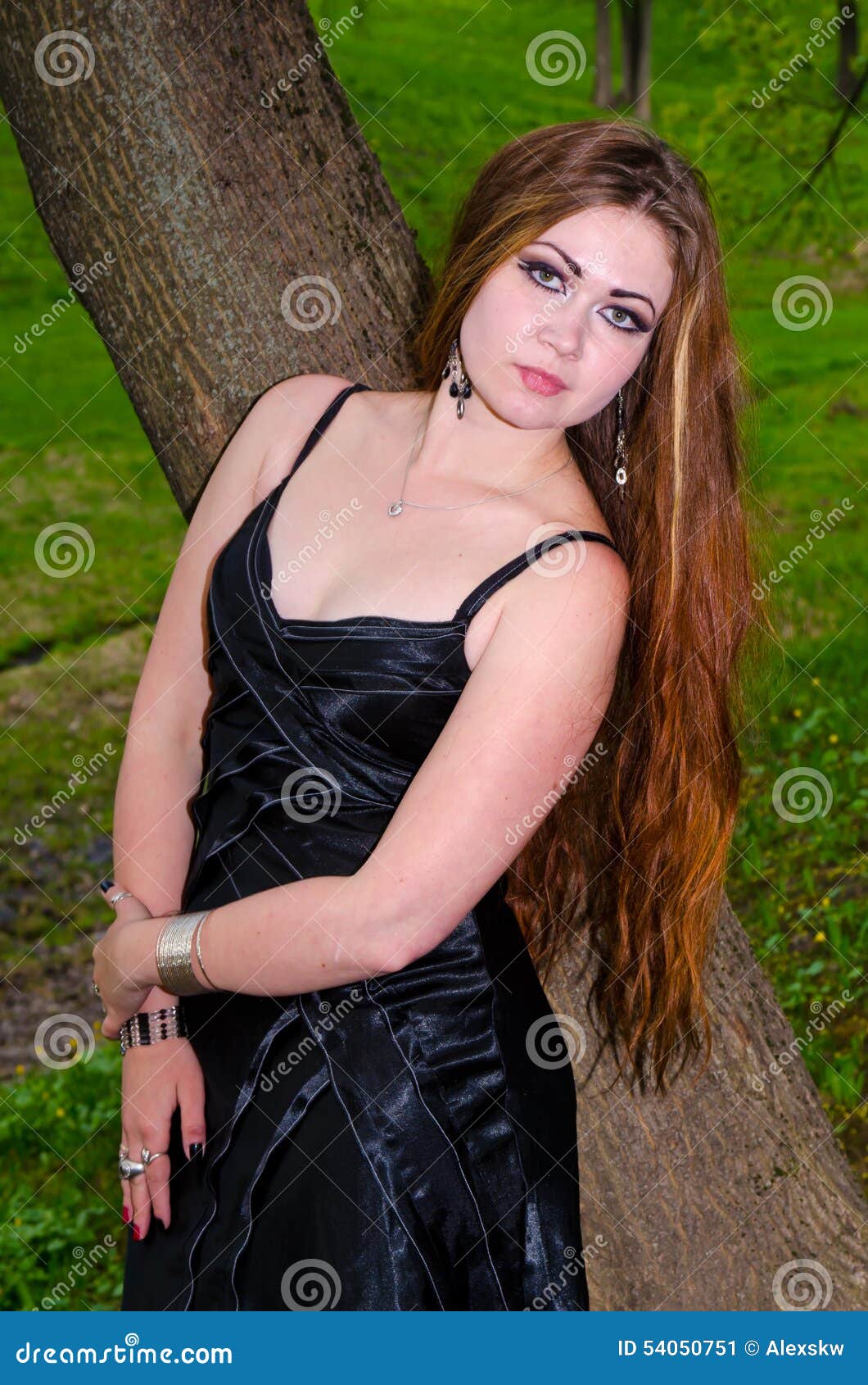 She is Leaning Back Against the Tree Stock Image - Image of eyes, black ...