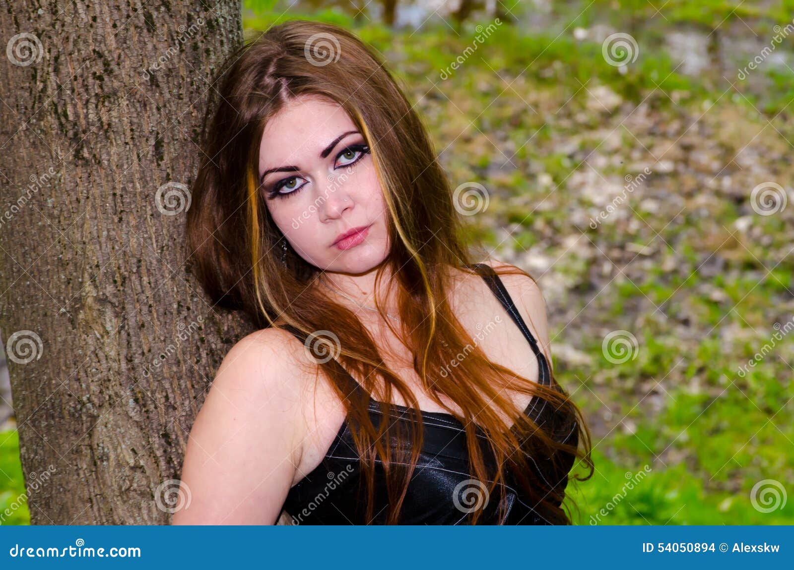 She is Leaning Back Against the Tree Stock Photo - Image of cute, adult ...