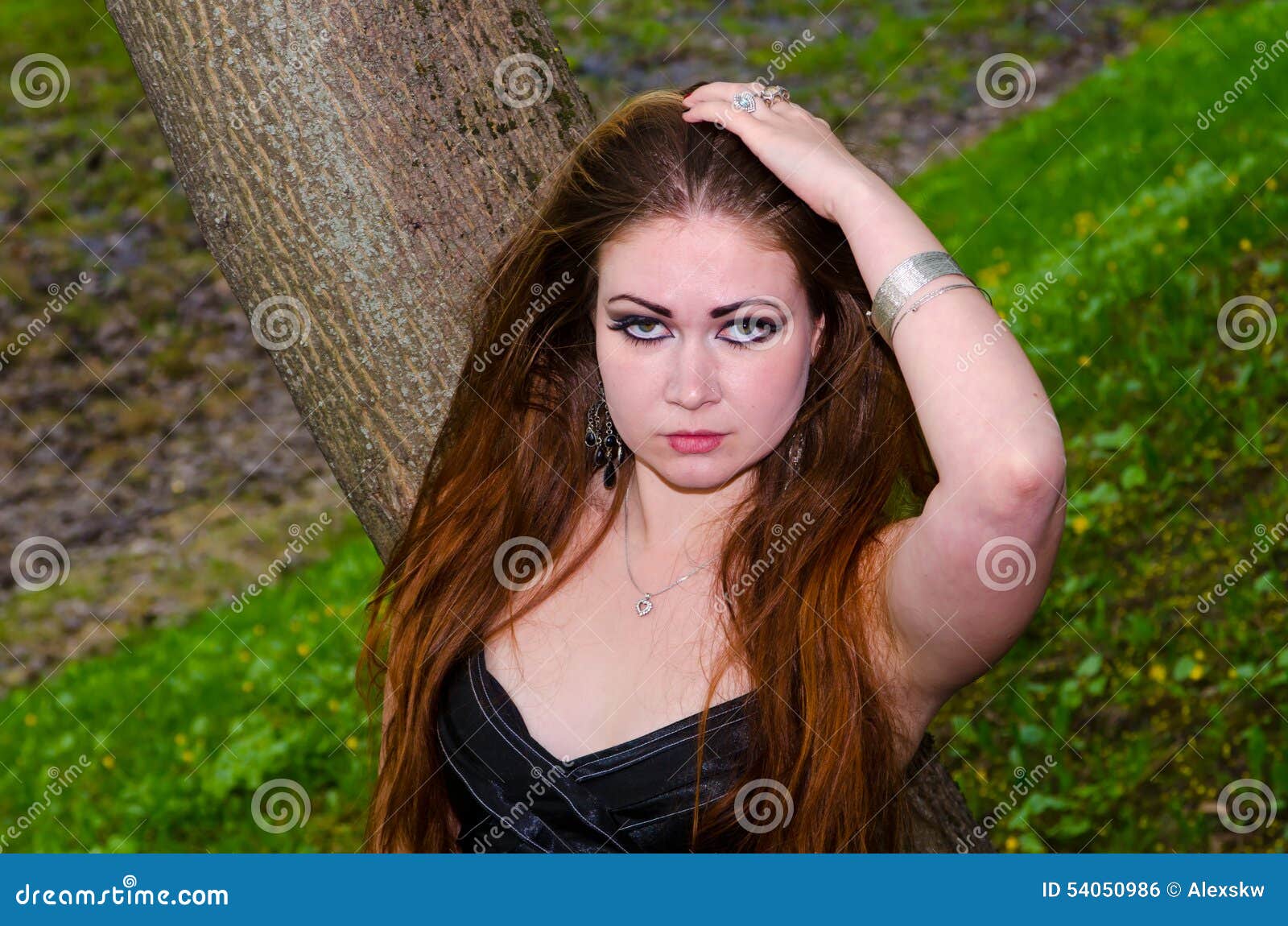 She is Leaning Back Against the Tree Stock Photo - Image of cheerful ...