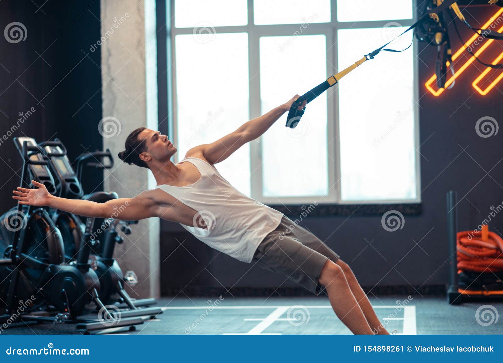 Handsome Well Built Man Looking at the Trx Stripe Stock Image - Image ...