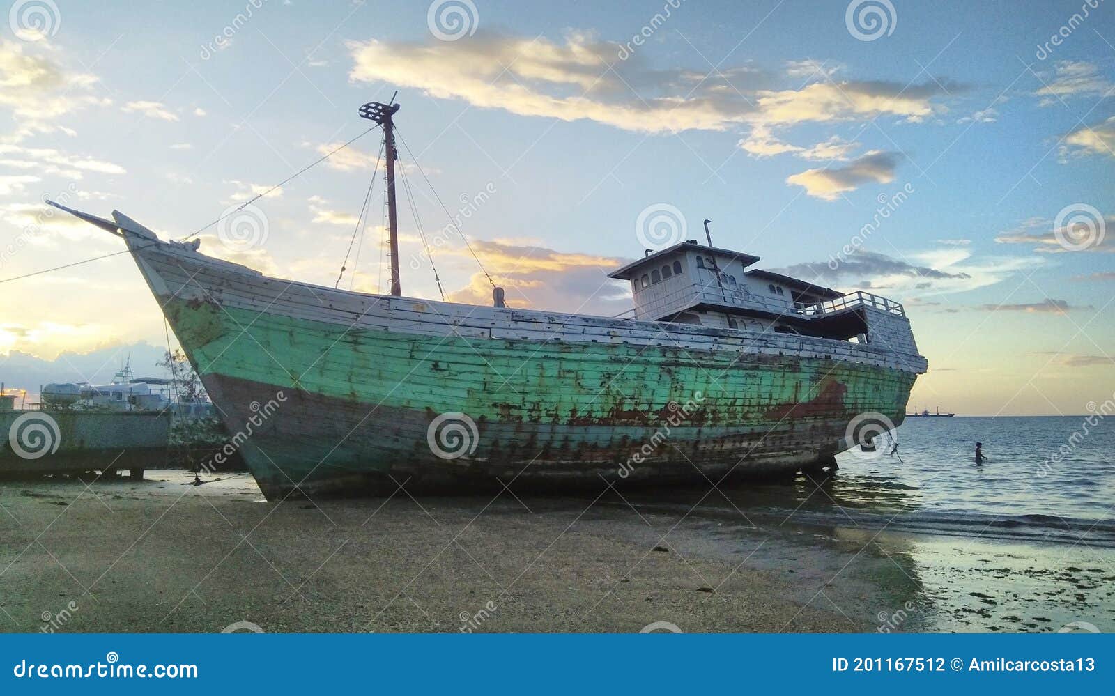 Leaning Ship at Dili Harbor, Timor-Leste. Editorial Photography - Image ...