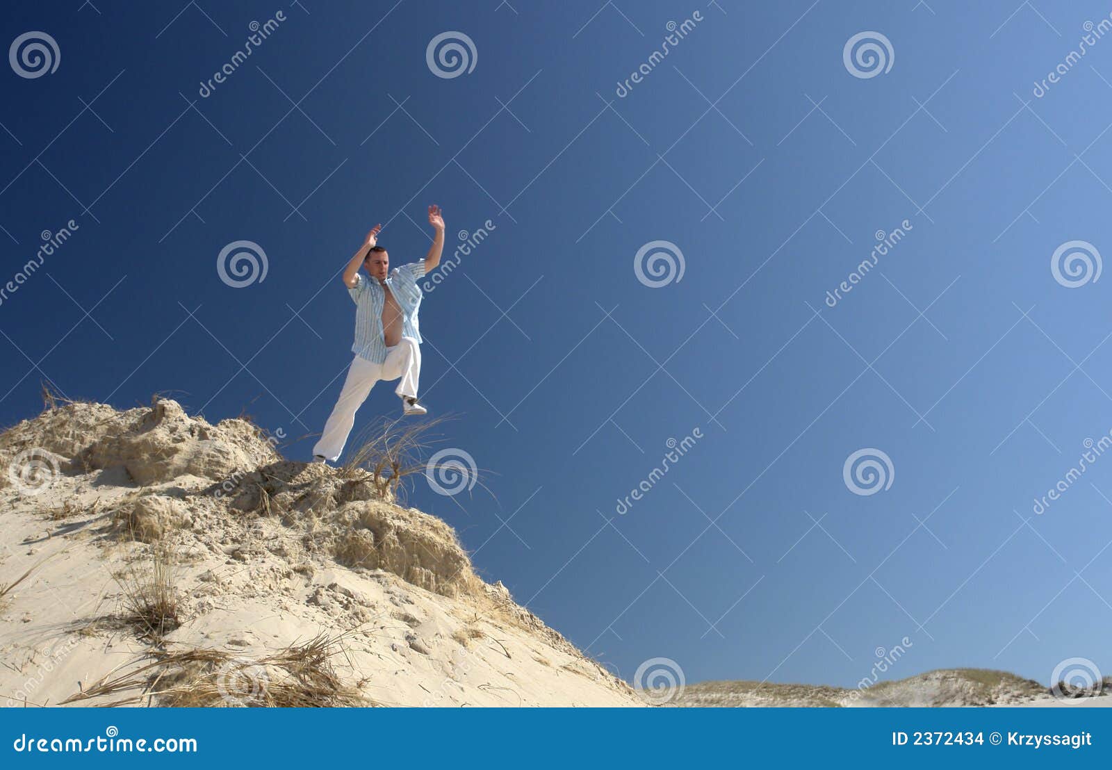 Leaping Man stock photo. Image of sand, hill, male, adult - 2372434