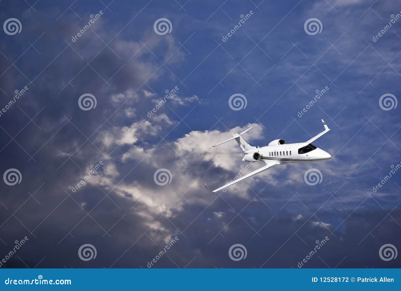 Learjet 45 with Blue Sky & Storm Clouds Stock Photo - Image of ...