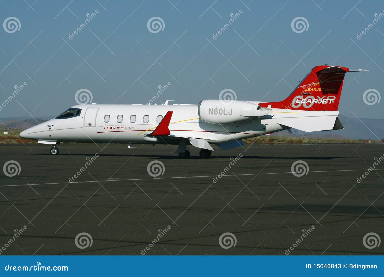 Aircraft Learjet Plane In Front Of The Airport With Cloudy Sky Stock ...