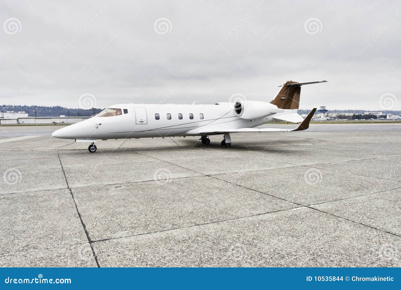 Aircraft Learjet Plane In Front Of The Airport With Cloudy Sky Stock ...