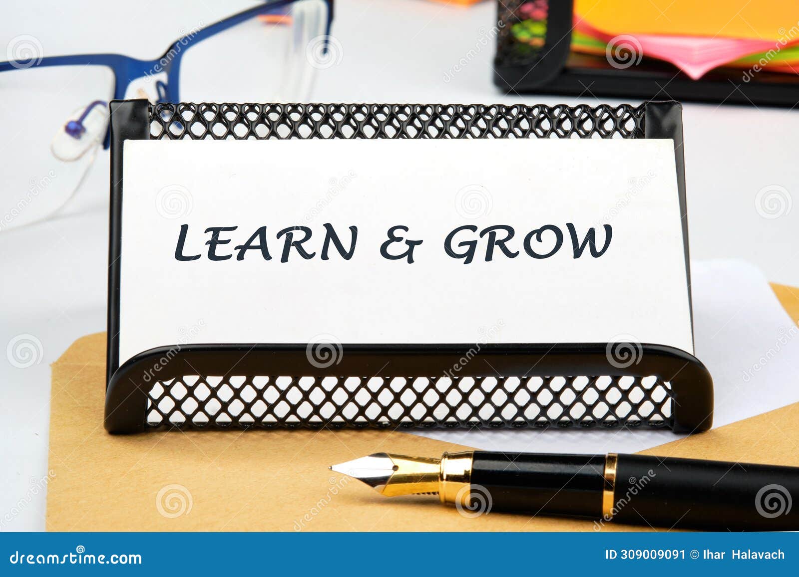 Learn and Grow Written on a Business Card on the Table Stock Image ...