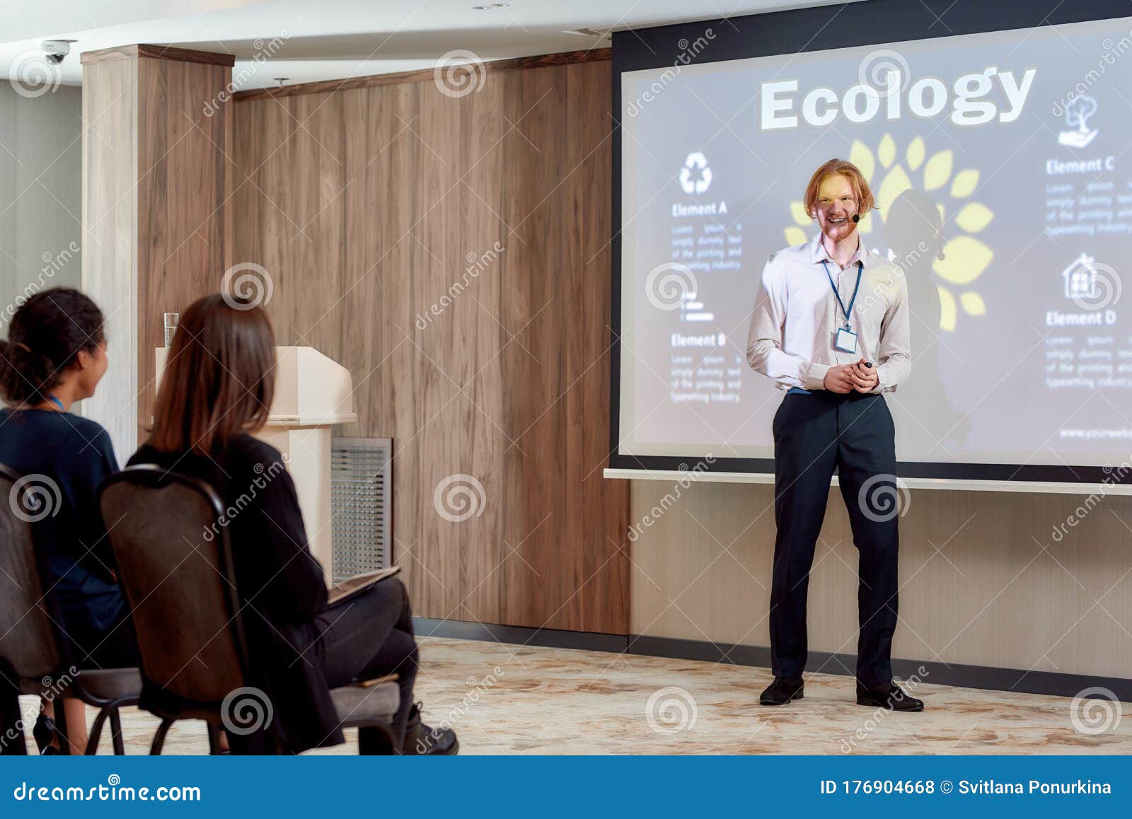 Learn Here. Full-length Shot of Young Male Speaker in Suit with Headset ...